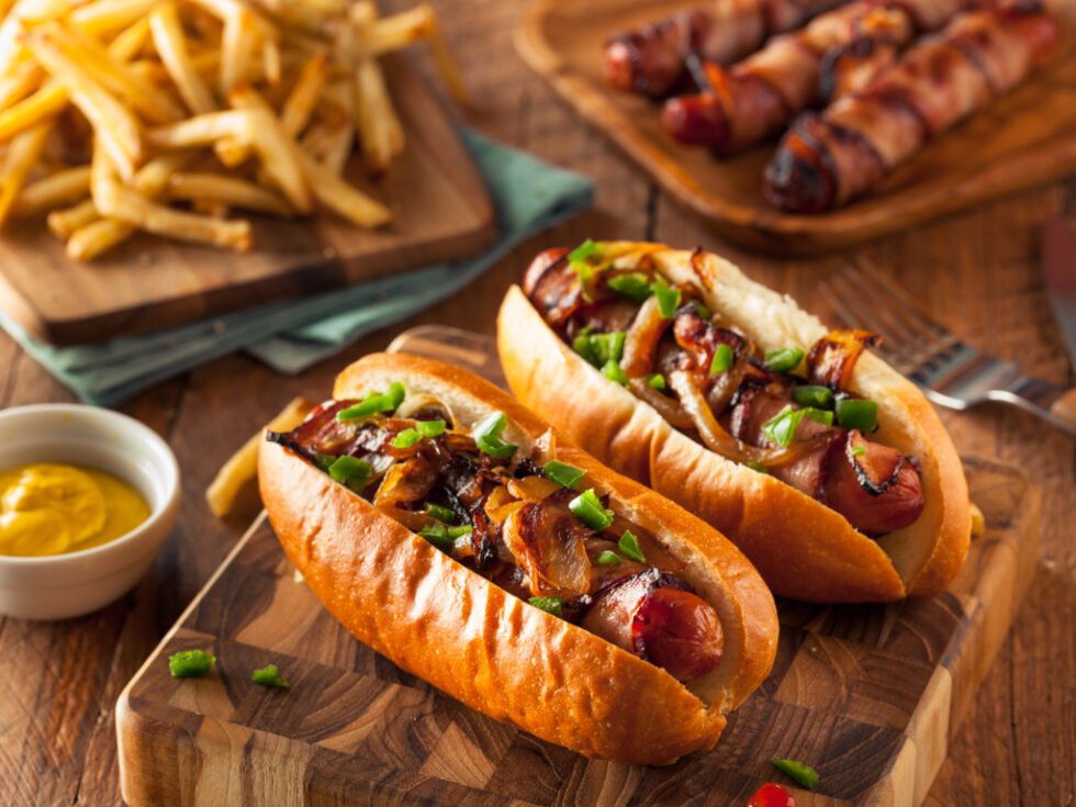 Bacon wrapped hot dogs with crispy onions - Helen Browning's Organics